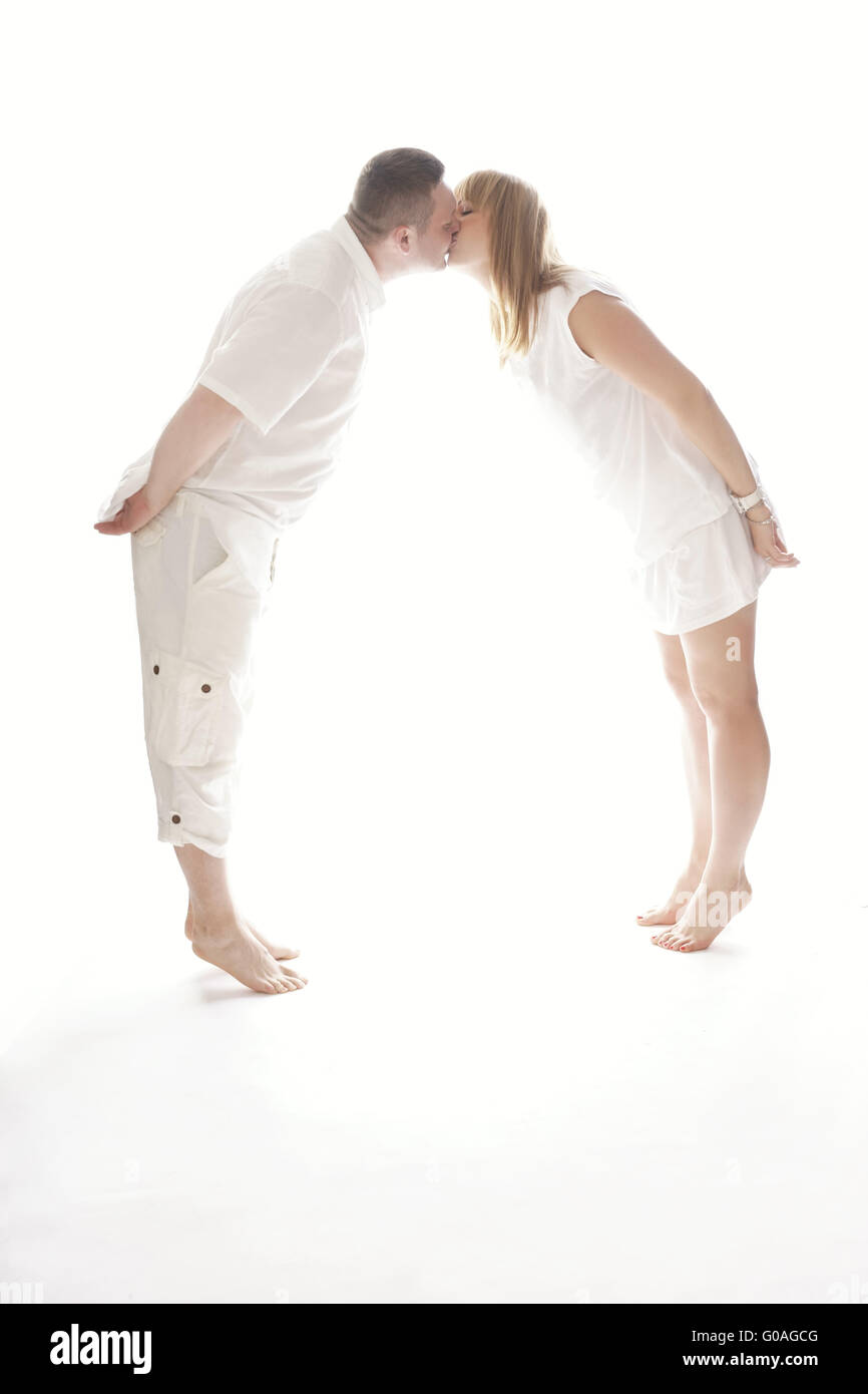 Lovely Couple Kissing While in Tiptoe Stock Photo - Alamy