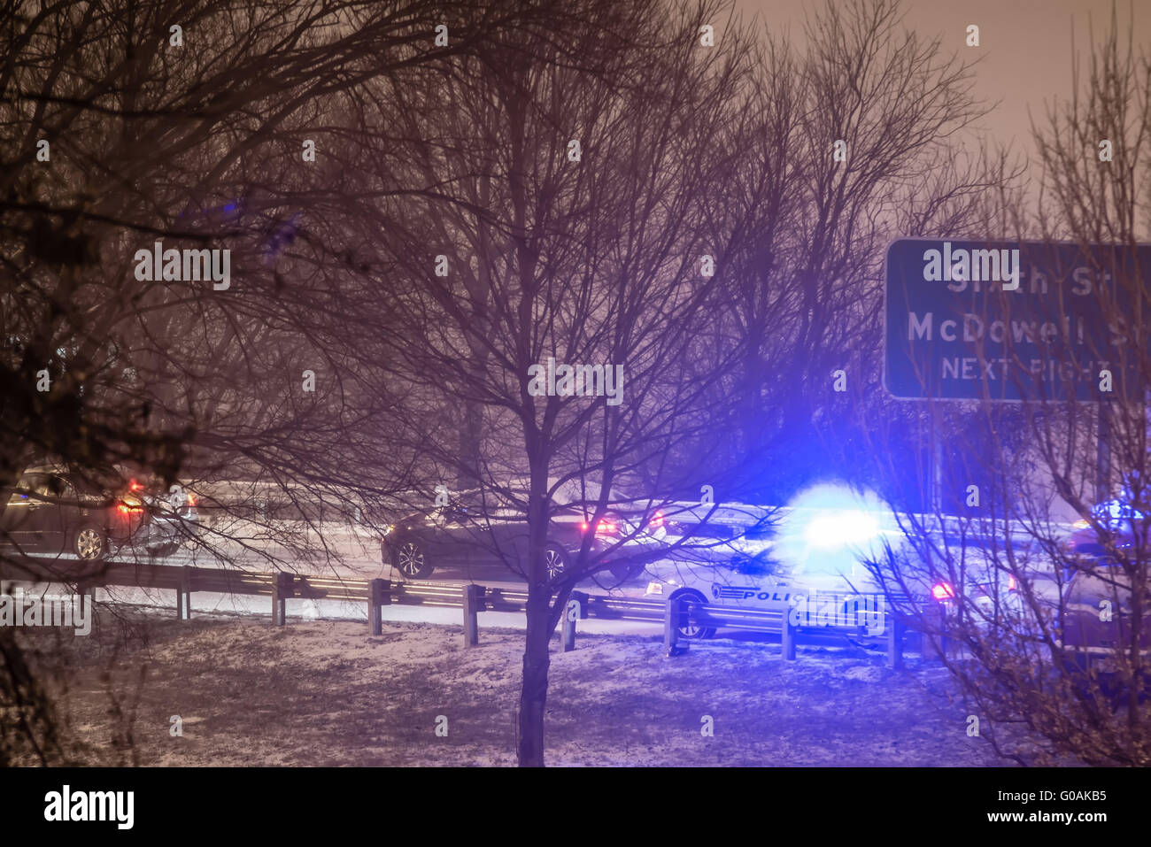 police helping injured driver after a crash during winter snowstrom in ...
