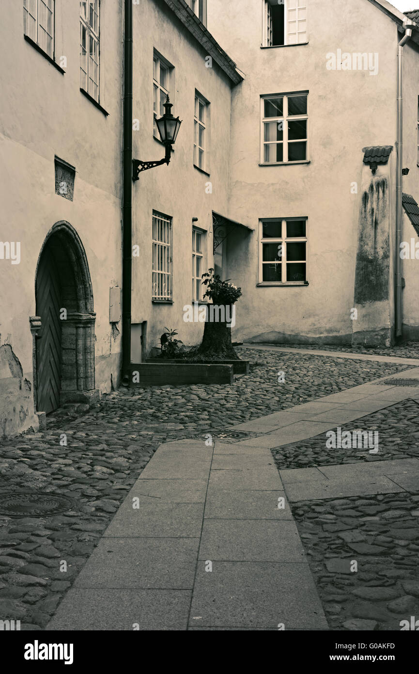 Retro style photo of typical european old town street Stock Photo - Alamy