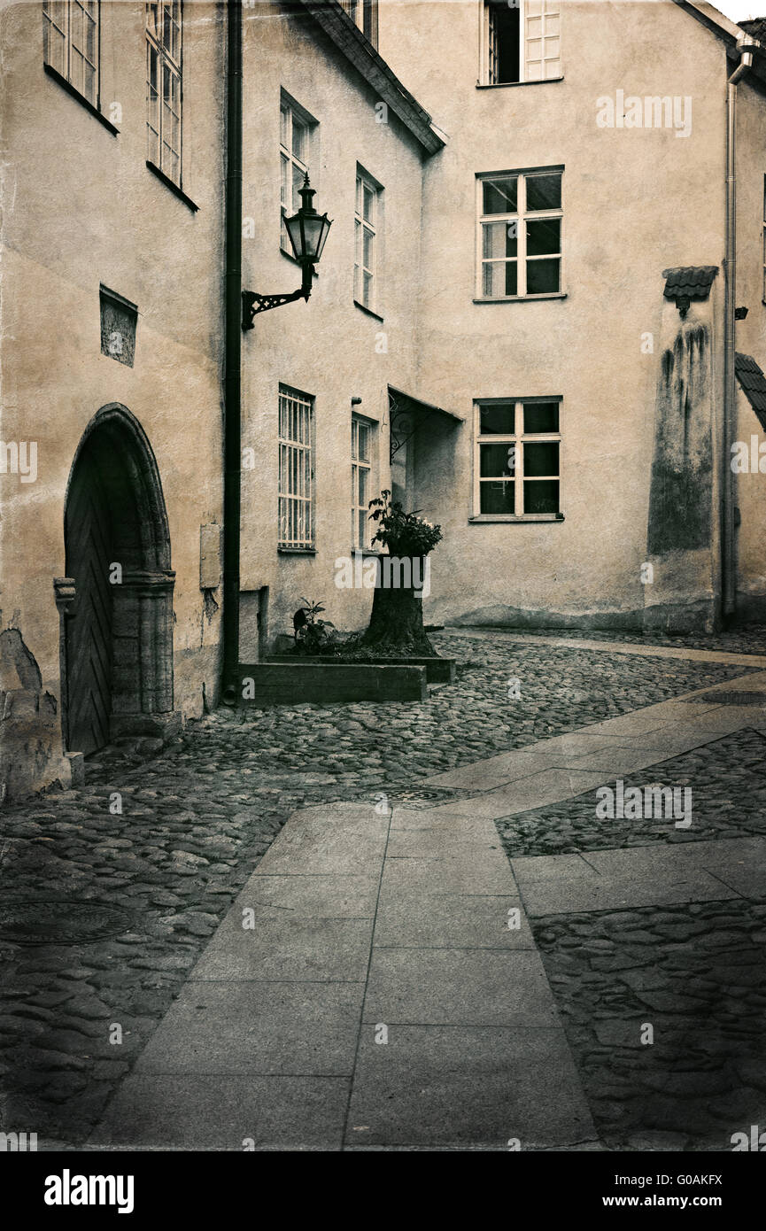 Retro style photo of typical european old town street Stock Photo - Alamy