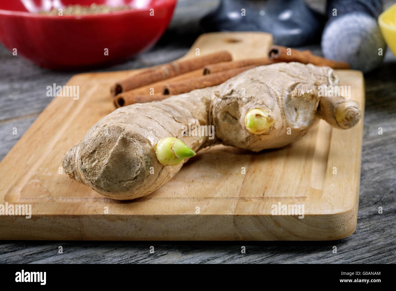 Still-life with ginger and cinnamon on an old kitchen table Stock Photo ...