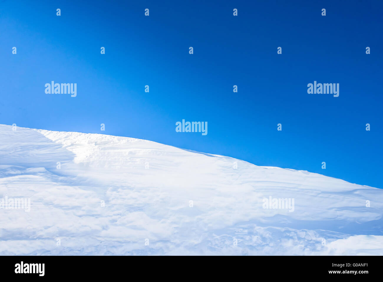 big snow hummock of pure white snow made wind Stock Photo - Alamy