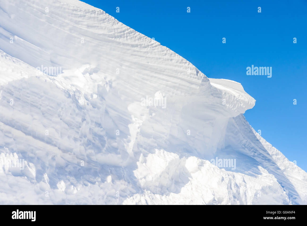 big snow hummock of pure white snow made wind Stock Photo - Alamy