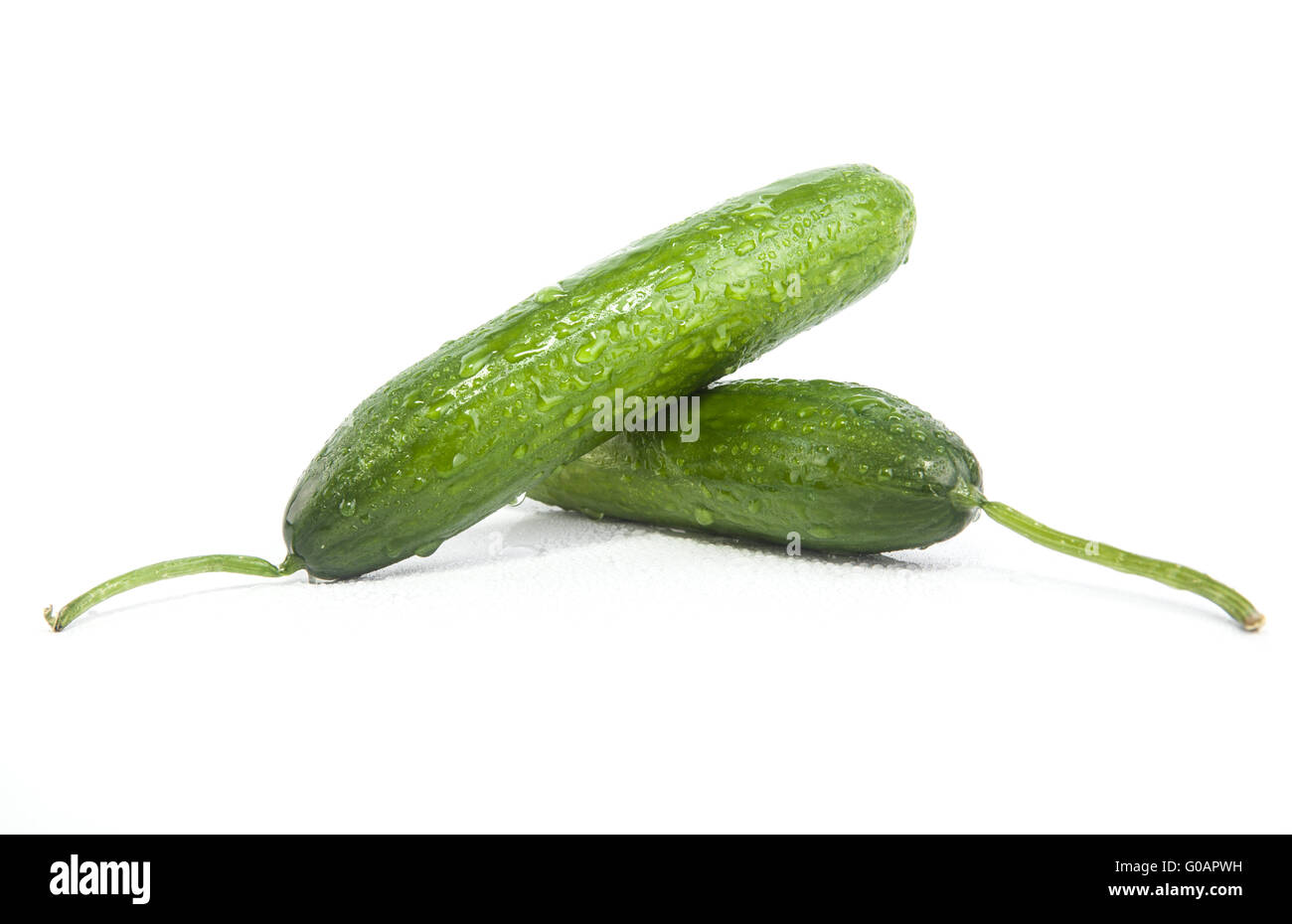 Two cucumbers isolated on white Stock Photo - Alamy