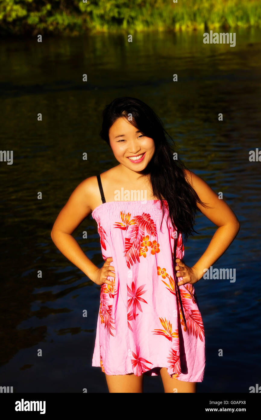 Japanese American Woman With Hands Akimbo Smiling Stock Photo - Alamy