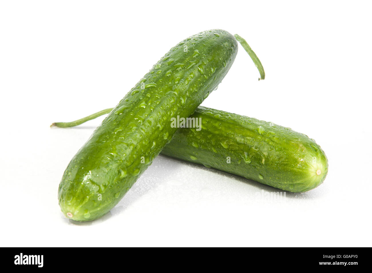 Two cucumbers isolated on white Stock Photo - Alamy