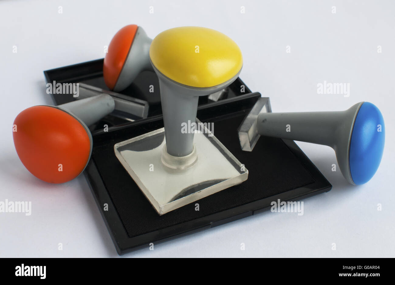 Plastic rubber stamps and inkpad isolated on grey Stock Photo - Alamy