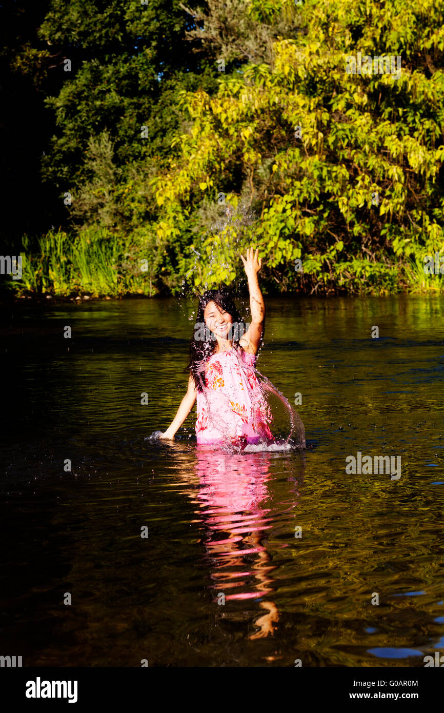 Attractive Japanese American Woman Splashing River Water Stock Photo ...
