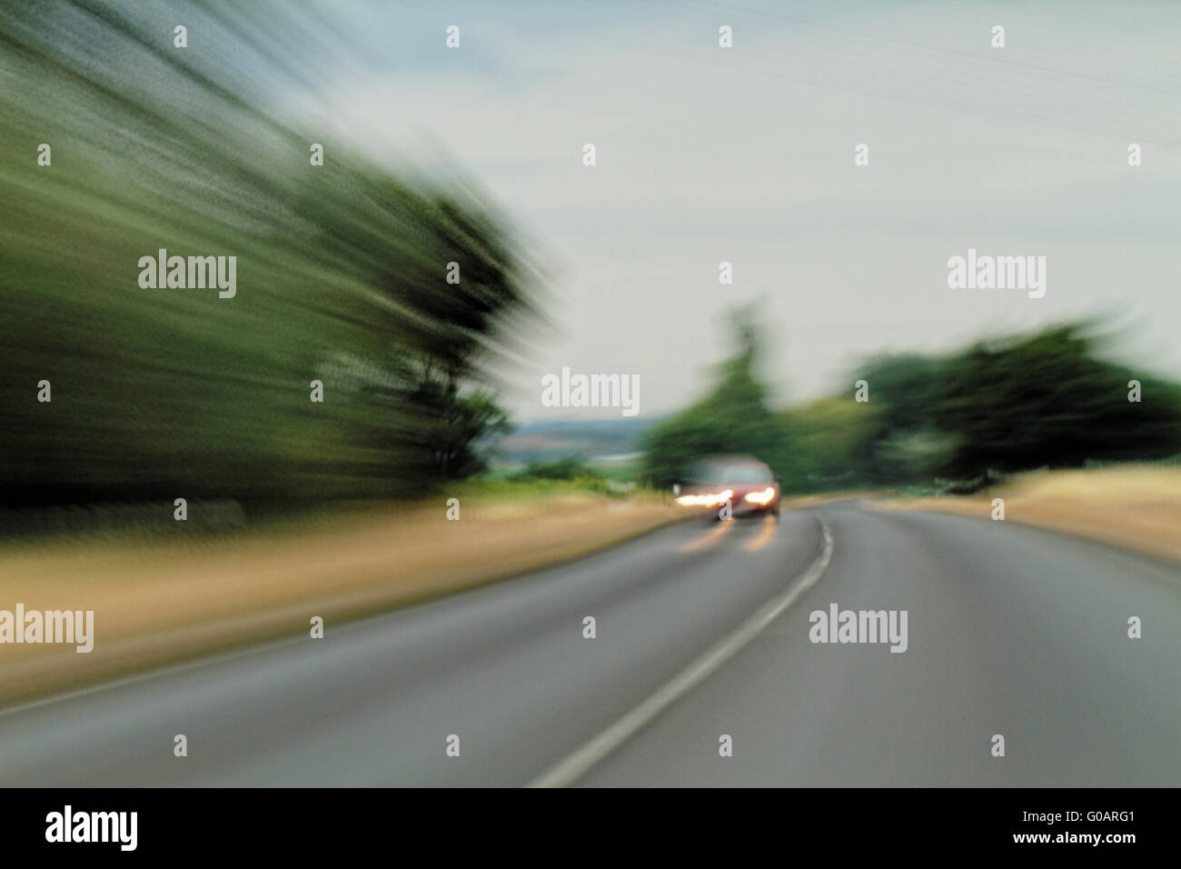 Speed on the road in nature - blur landscape Stock Photo - Alamy