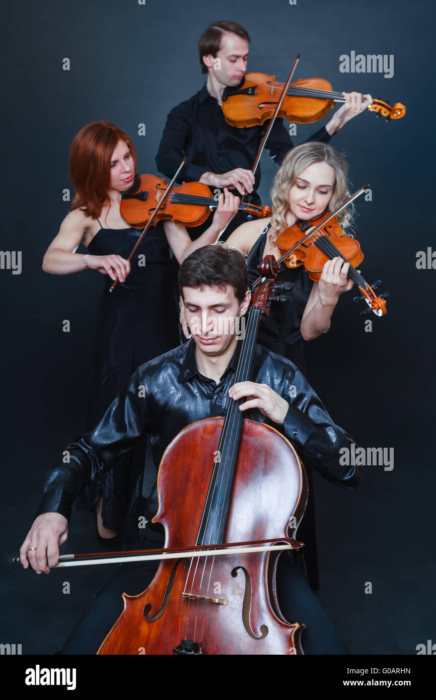 Cellists and violinists Stock Photo - Alamy