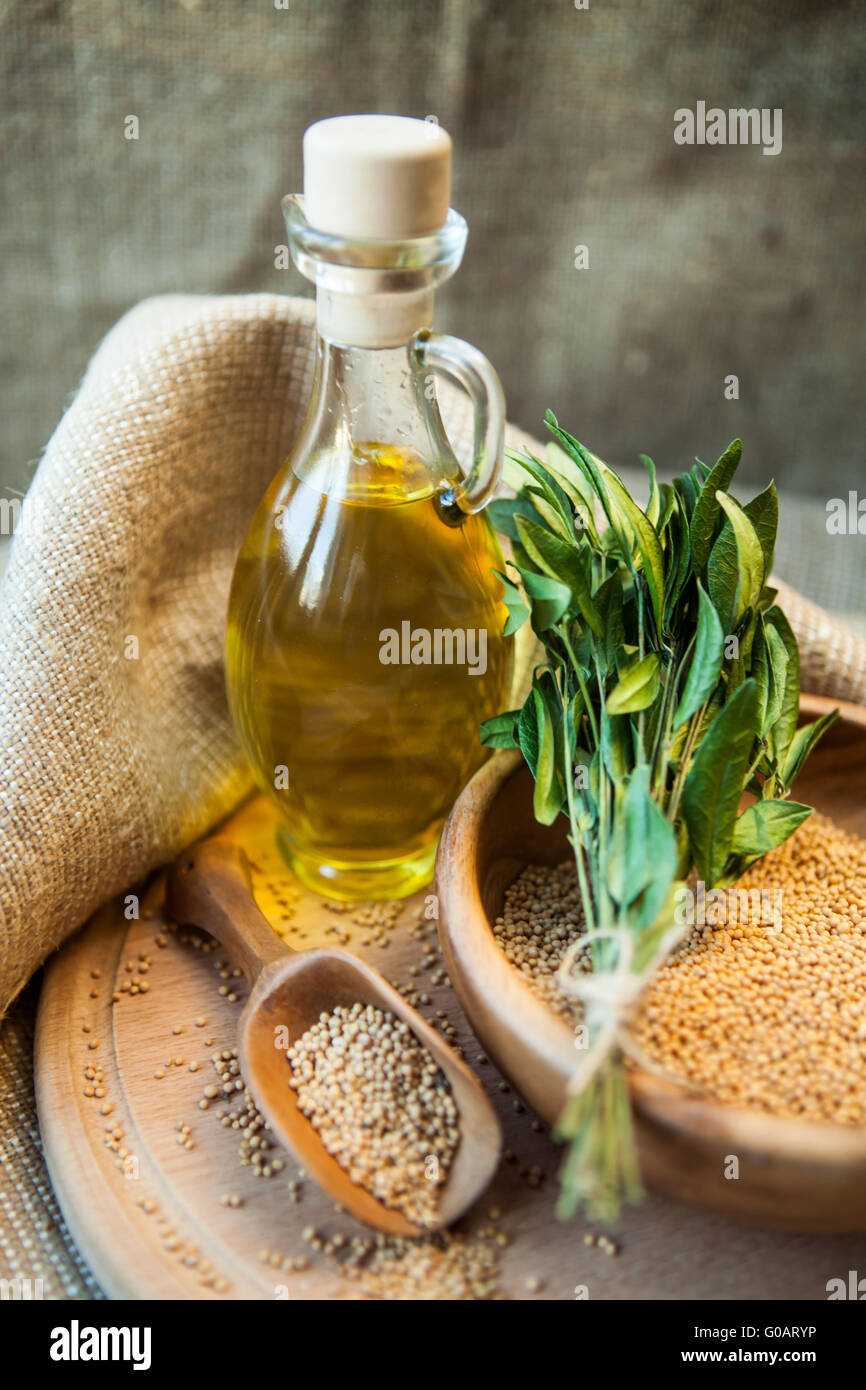 mustard oil in a vessel with seeds Stock Photo - Alamy