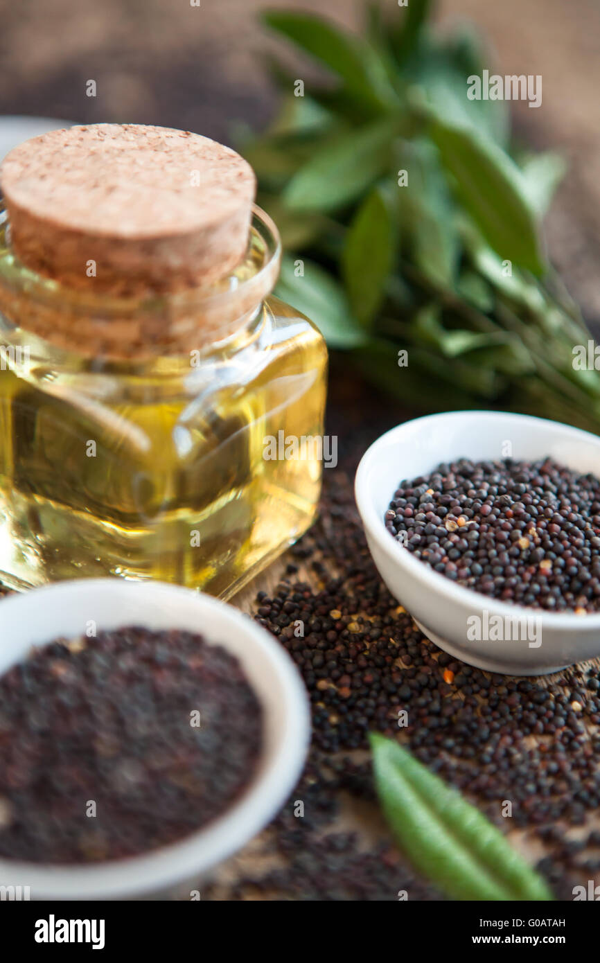 canola oil in a vessel with seeds Stock Photo - Alamy