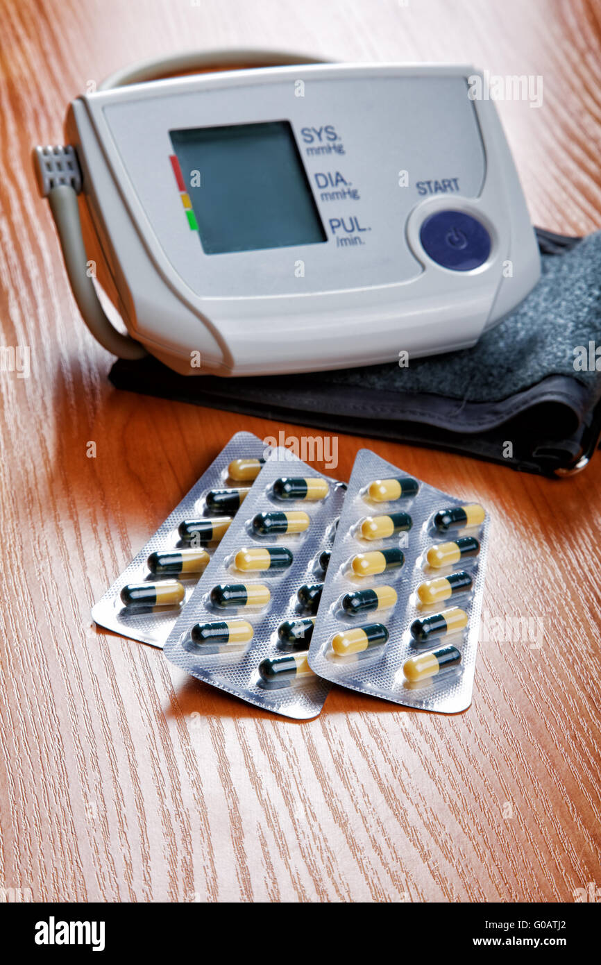 Tablets and the device for pressure measurement on a table Stock Photo ...
