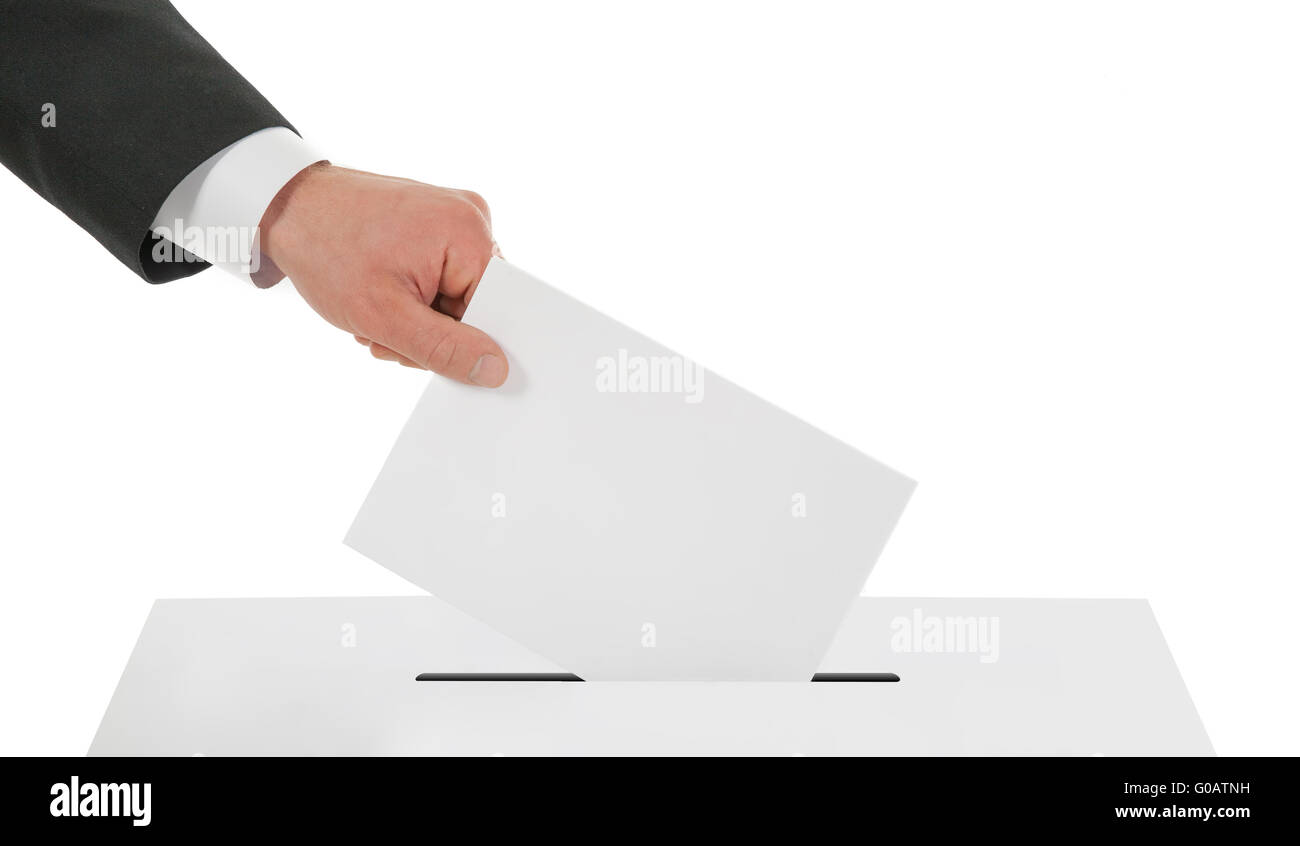 Man's hand down the ballot in the ballot box Stock Photo - Alamy