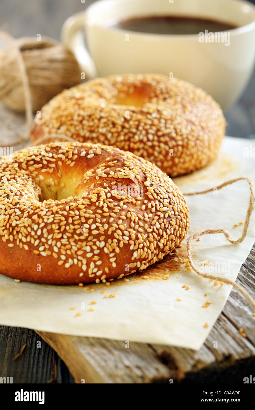 Breakfast. Sweet bagels with sesame seeds and coffee Stock Photo - Alamy
