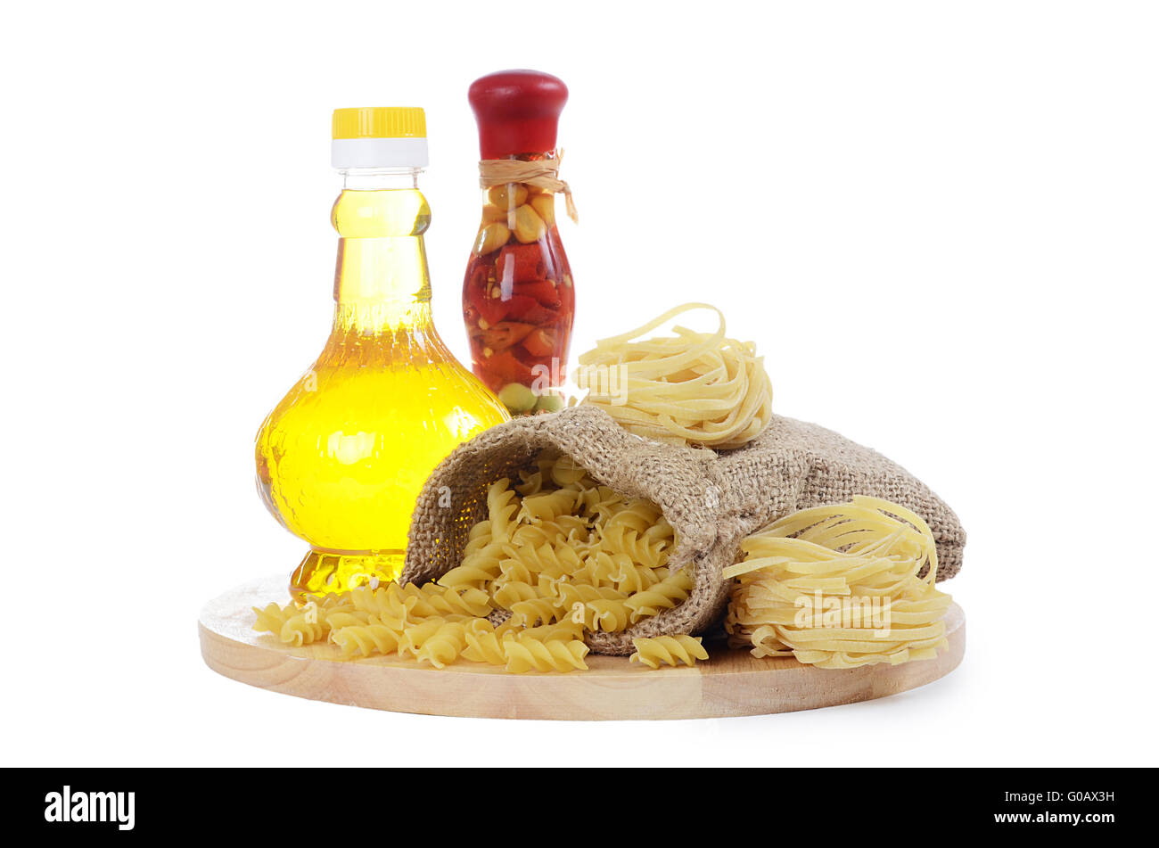 Pasta with an olive oil isolated on white background Stock Photo - Alamy