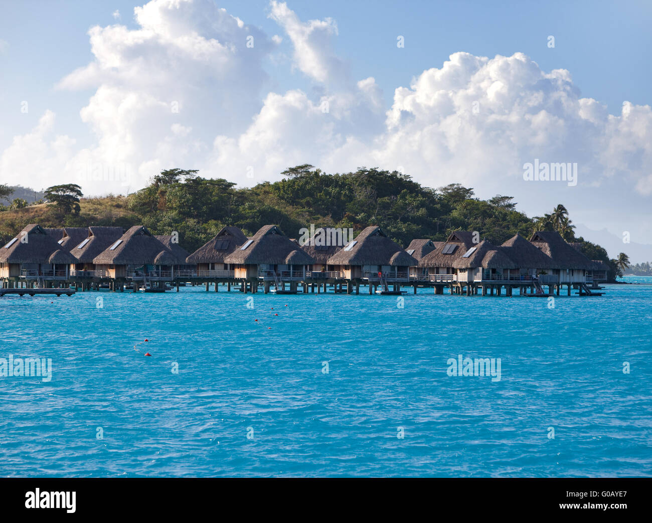 seacoast with palm trees and small houses on water Stock Photo - Alamy