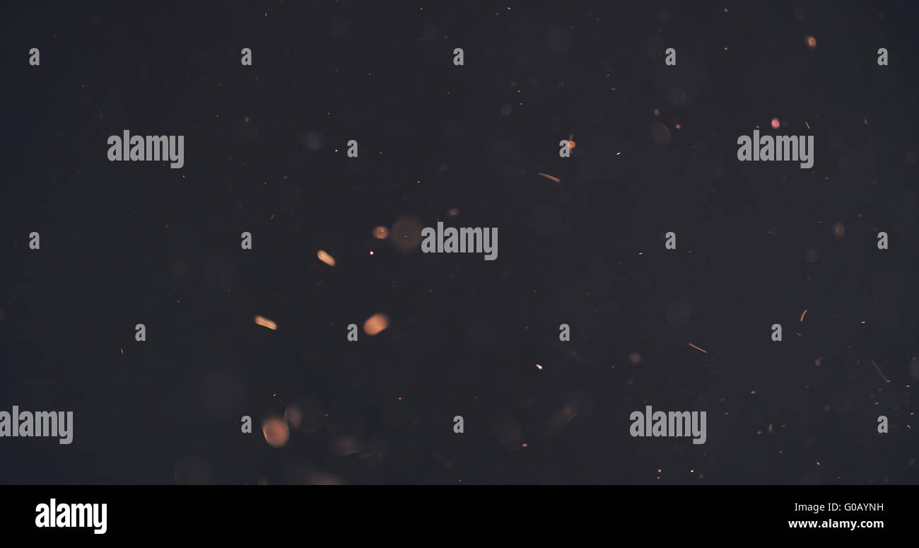 orange particles like spark slowly float in air Stock Photo - Alamy