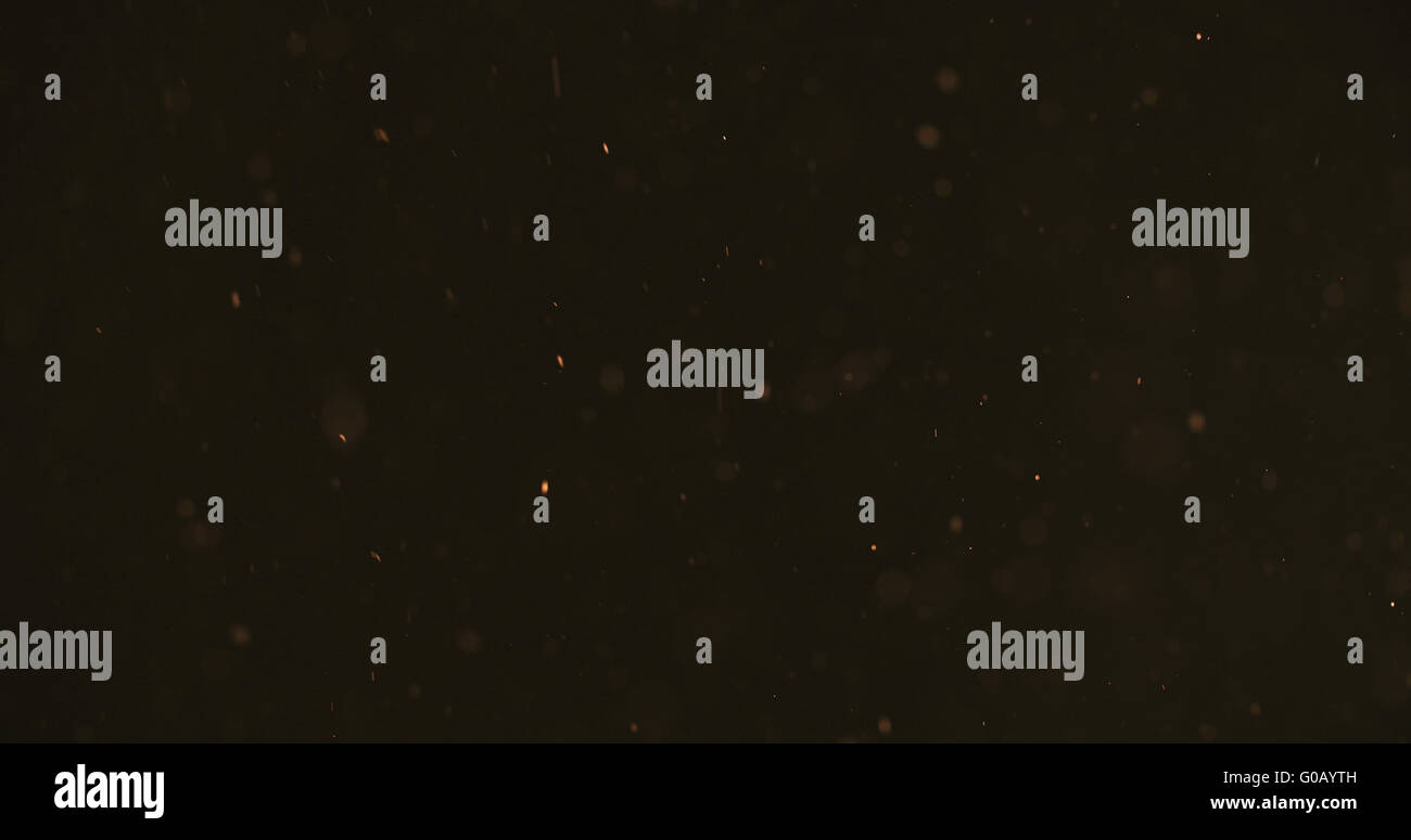 orange particles like spark slowly float in air Stock Photo - Alamy