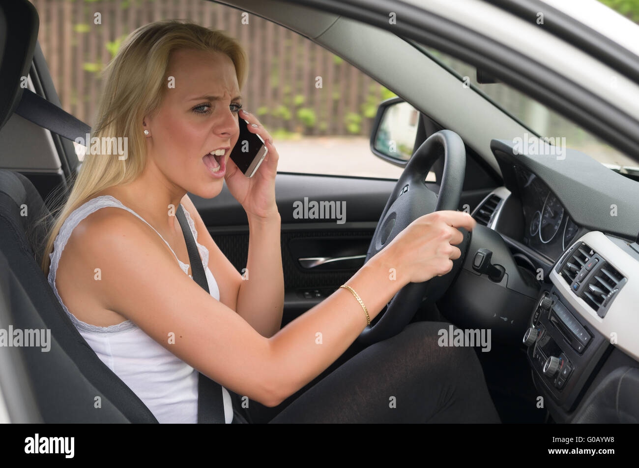 Calling while Driving 7 Stock Photo - Alamy