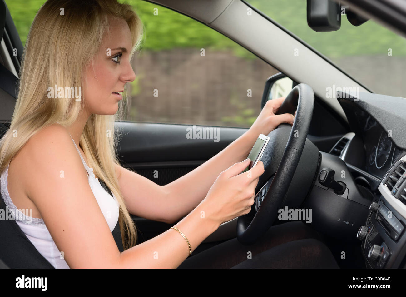 Driving and Texting 1 Stock Photo - Alamy