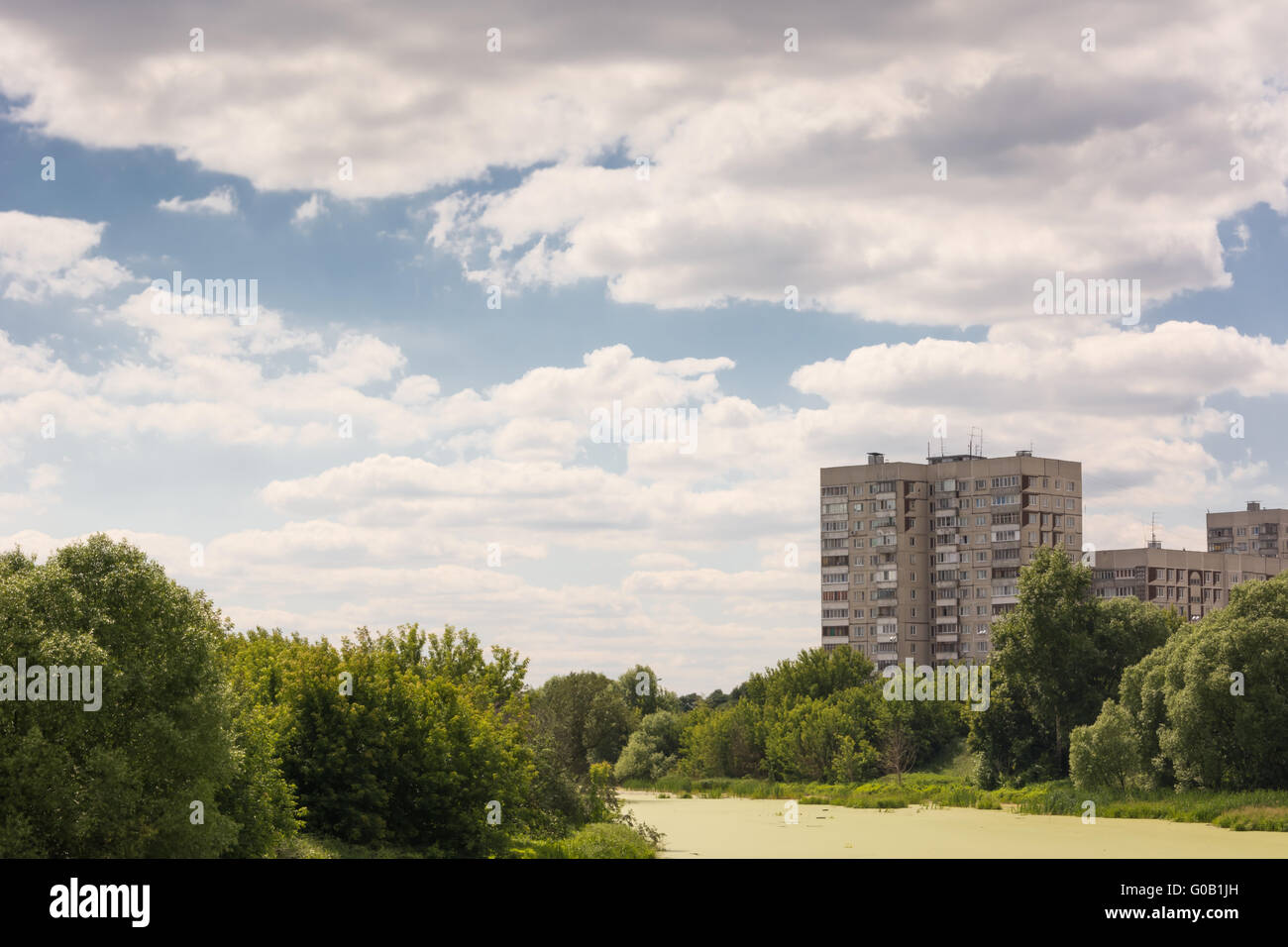 Suburban landscape with river and blue sky Stock Photo - Alamy