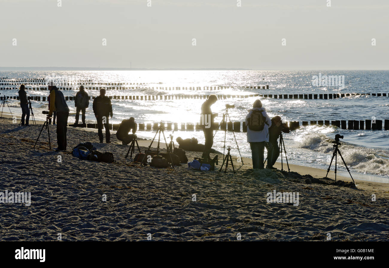photographers at the the beach of the Eastern sea Stock Photo - Alamy