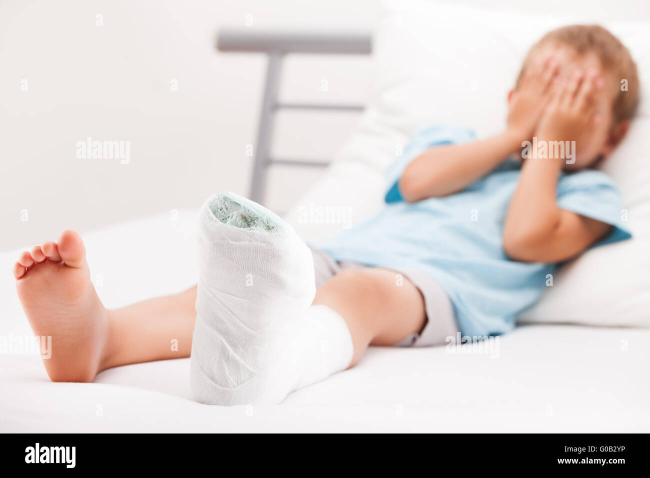 Little child boy with plaster bandage on leg heel Stock Photo - Alamy