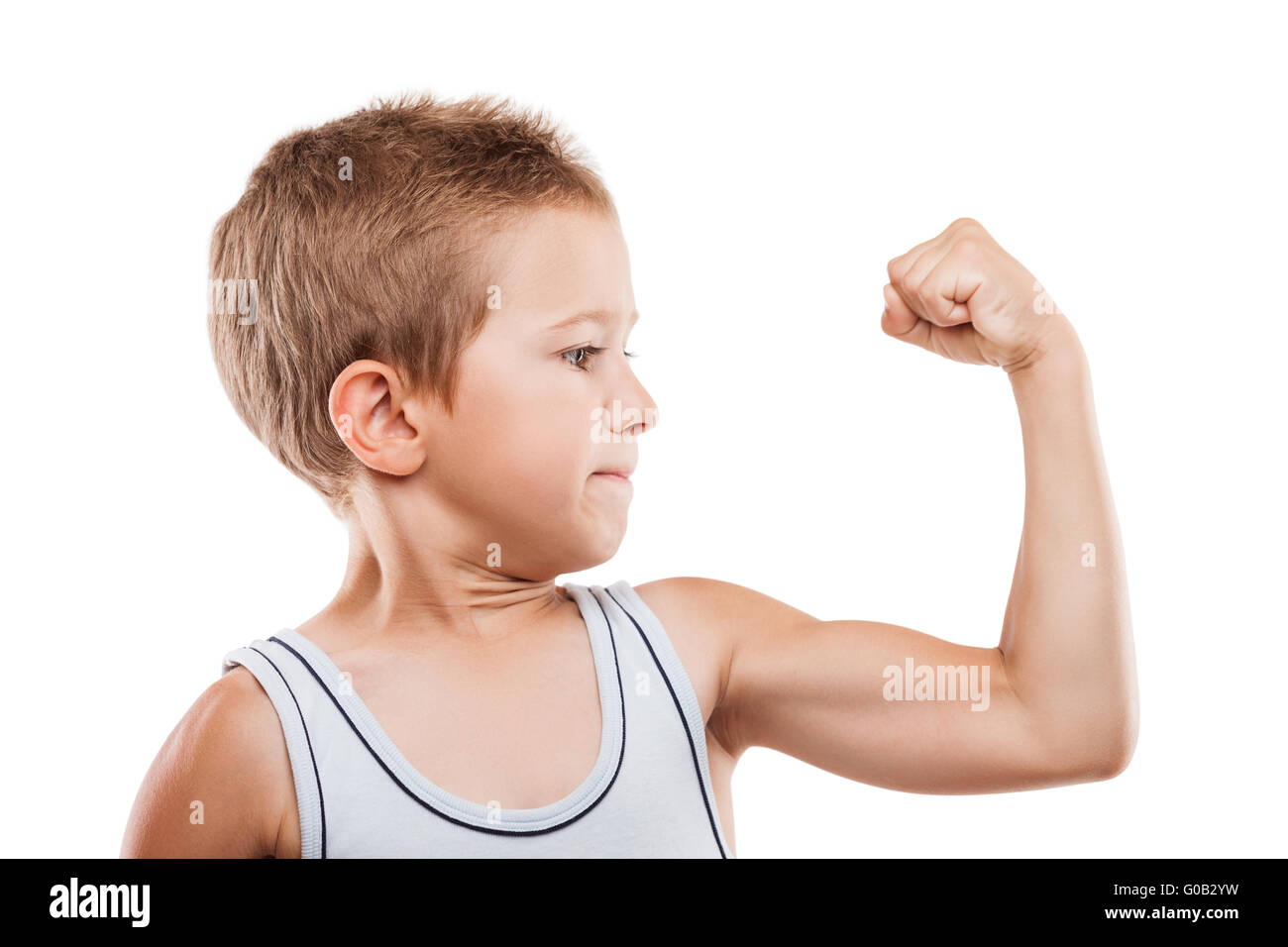 Smiling sport child boy showing hand biceps muscle Stock Photo - Alamy