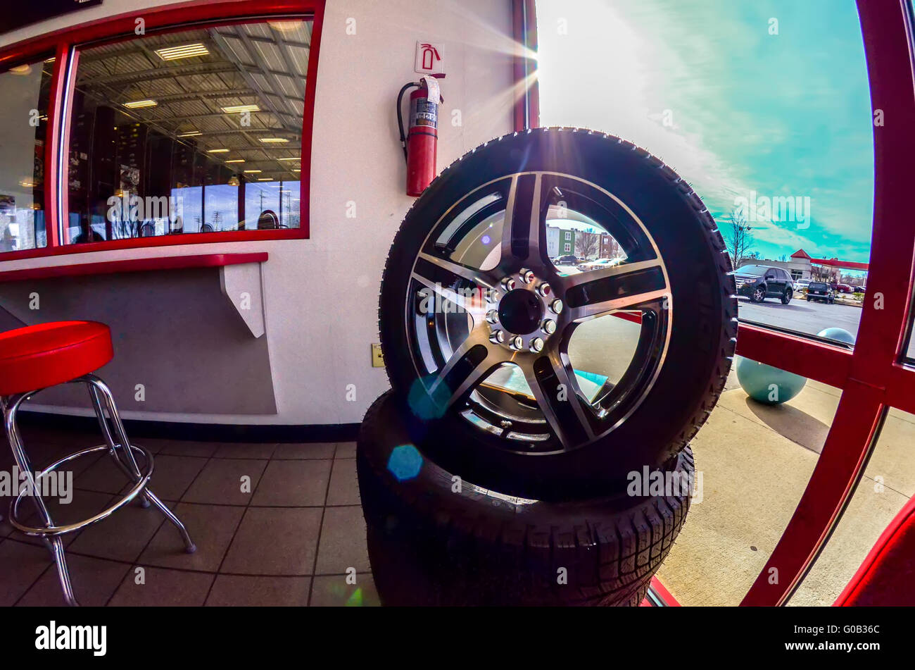 car tires on display for sale at a tire shop store Stock Photo - Alamy