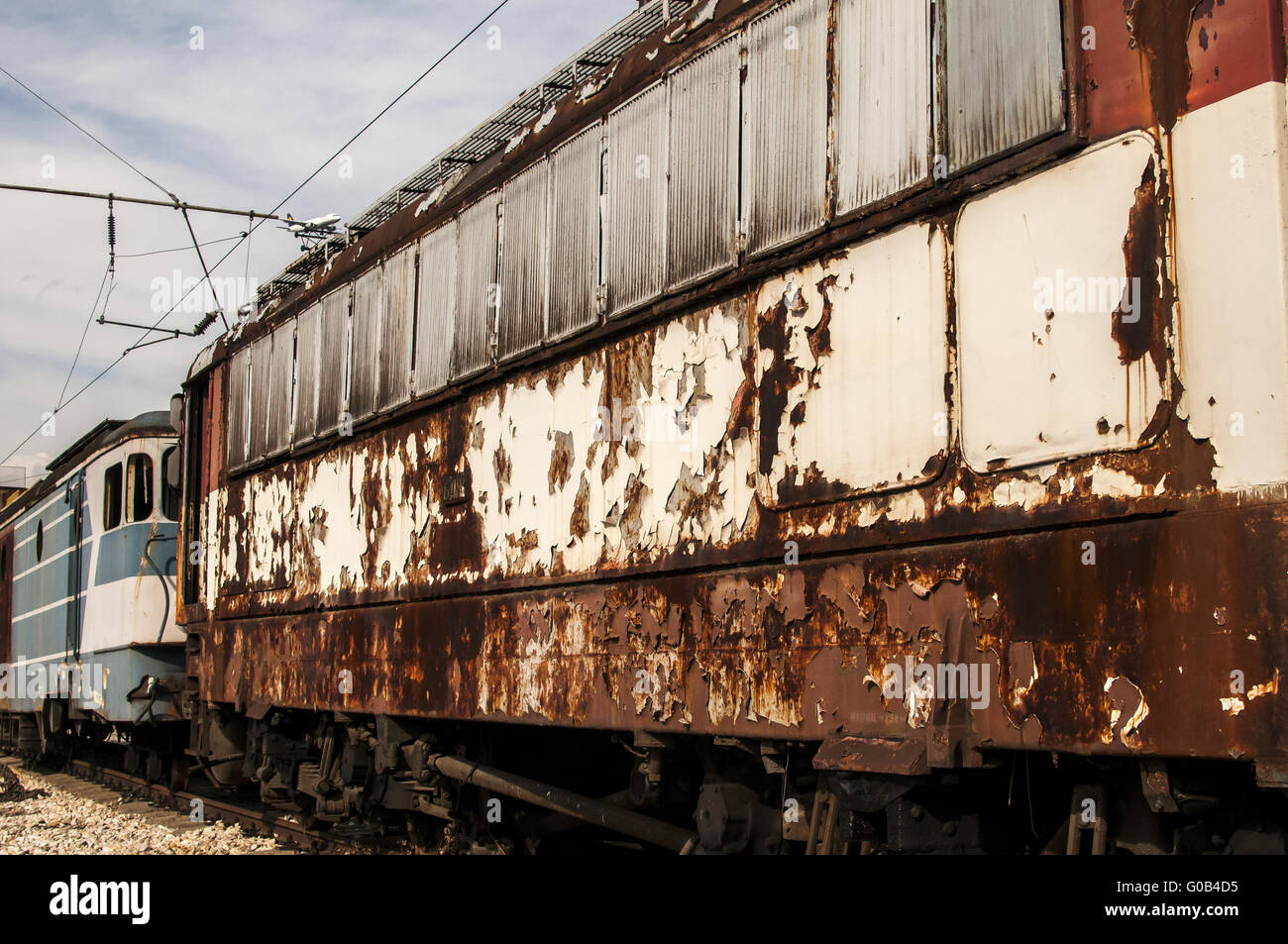 Abandoned rusty rail-cars with cracked peeling pai Stock Photo - Alamy