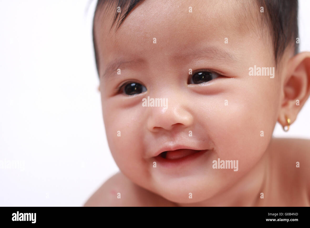 Close up portrait of cute little Asian baby girl smiling happily Stock ...