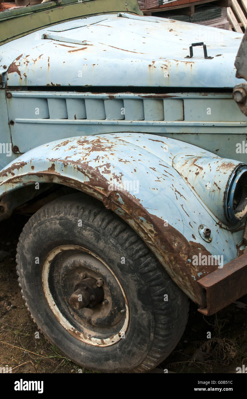 Wheel, rusty mud-guard and car hood of vintage car Stock Photo - Alamy