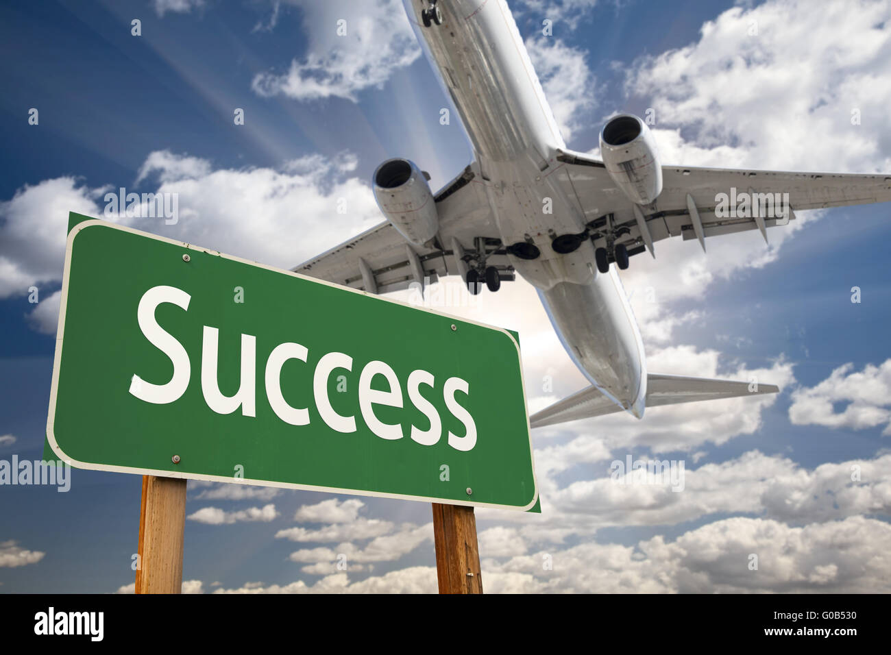 Success Green Road Sign and Airplane Above Stock Photo - Alamy