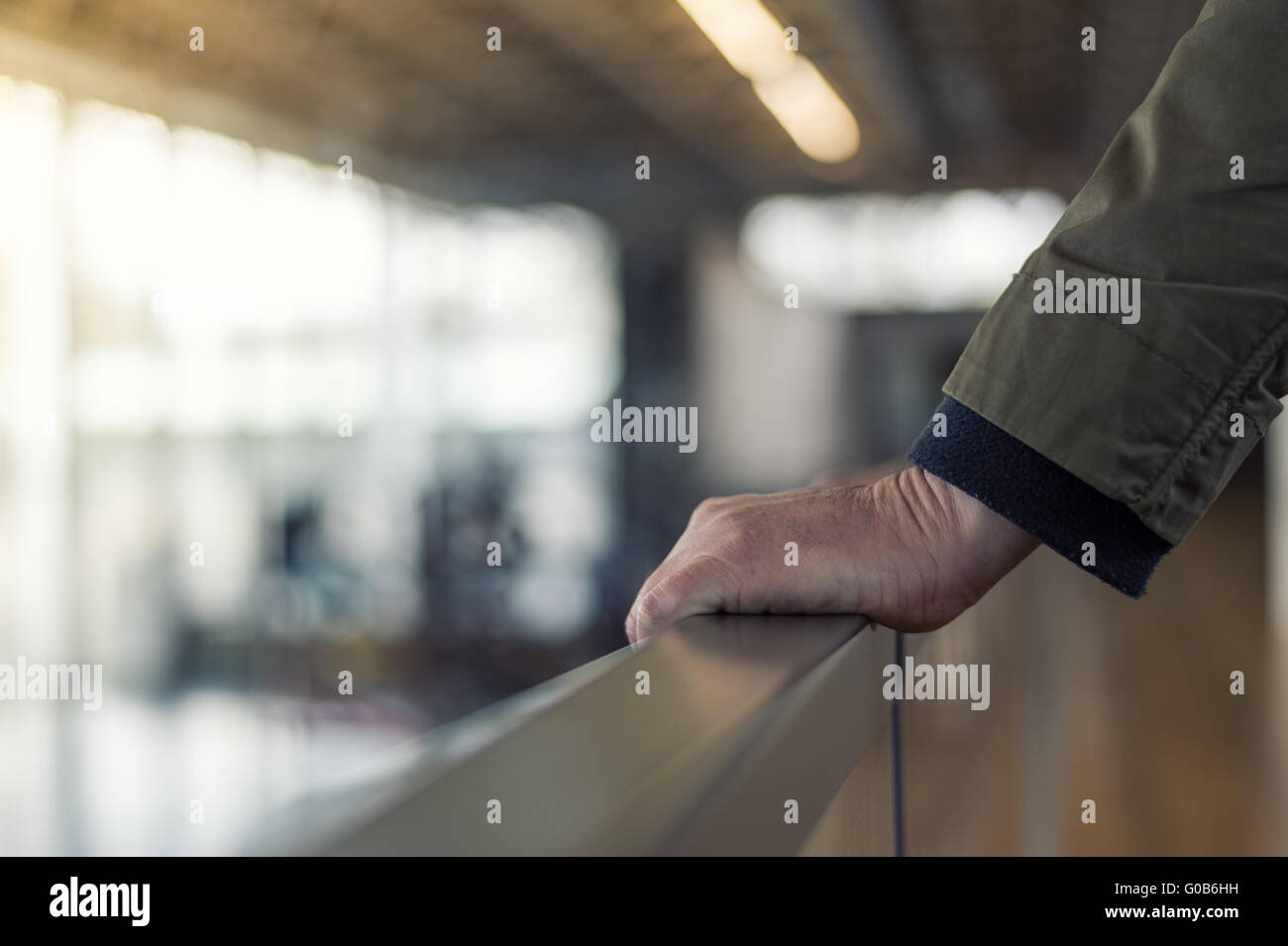a hand on a railing Stock Photo - Alamy