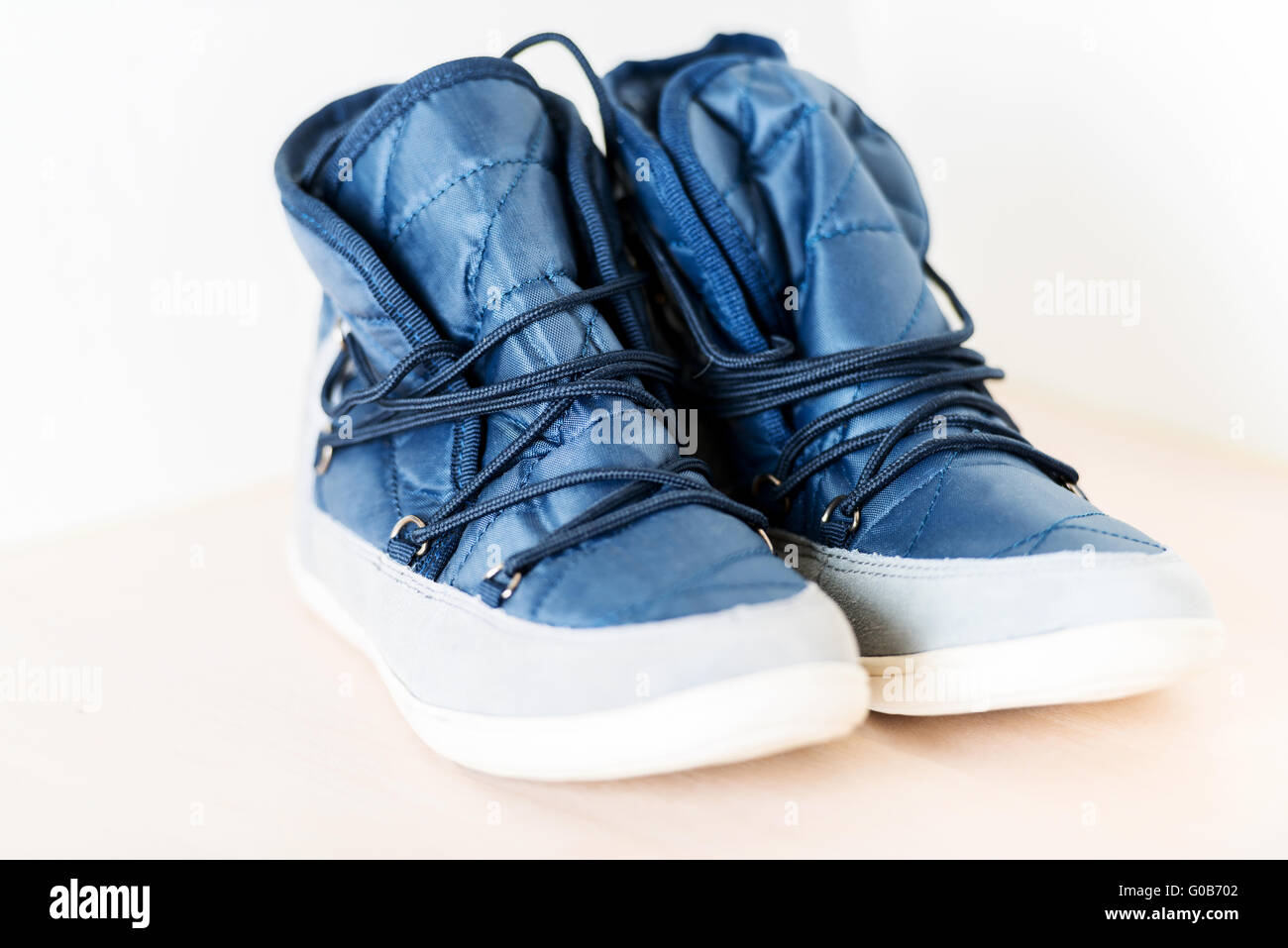 Pair of dark blue female boots with shoe string horizontal Stock Photo ...