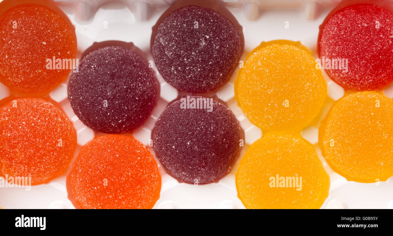 Round jelly sprinkled with sugar in a plastic box Stock Photo - Alamy
