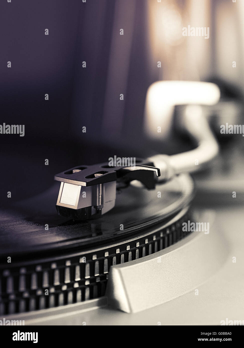 Pick-up arm of a record player which plays a recor Stock Photo - Alamy