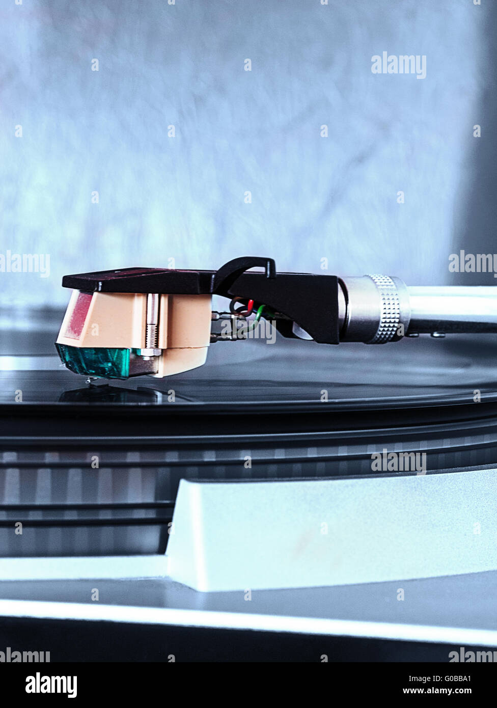 Pick-up arm of a record player which plays a recor Stock Photo - Alamy