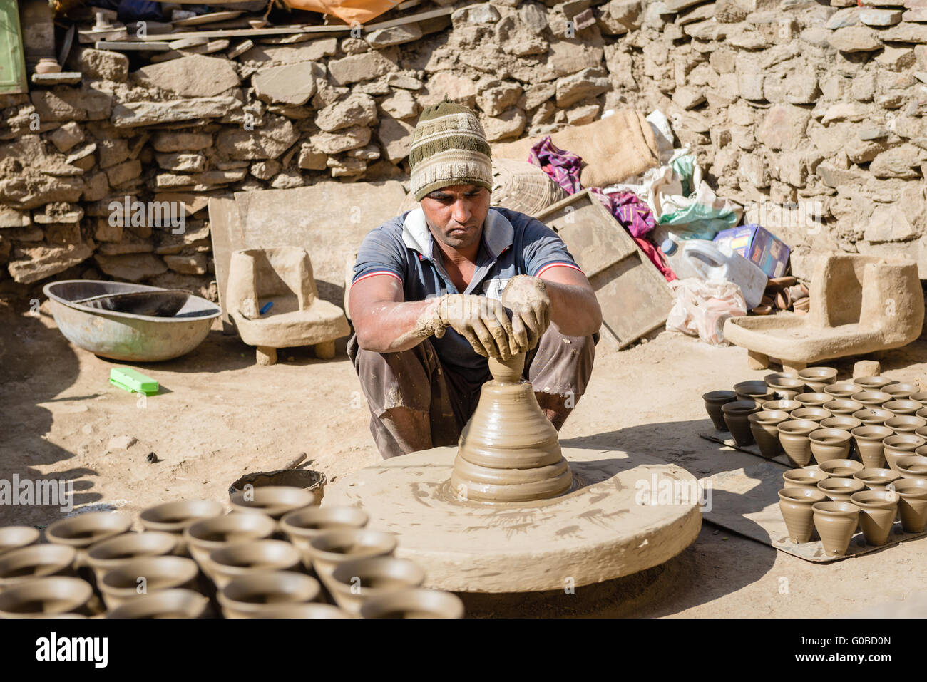 Potter making clay cups in old town Udaipur Stock Photo - Alamy