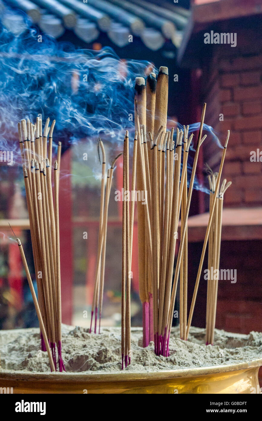 Incense sticks burning in temple hi-res stock photography and images ...