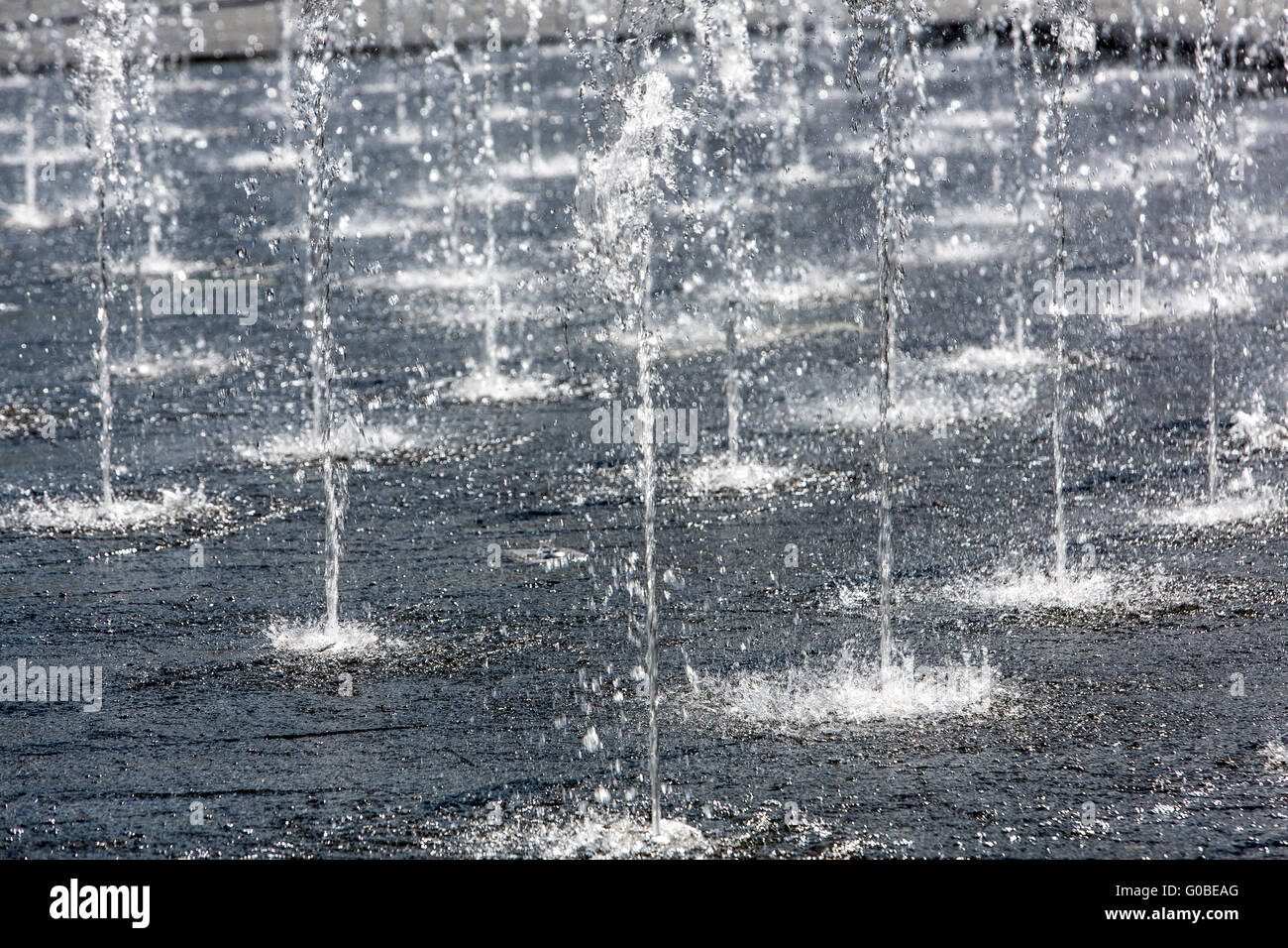 Fountain, embedded in the ground, water fountains Stock Photo - Alamy