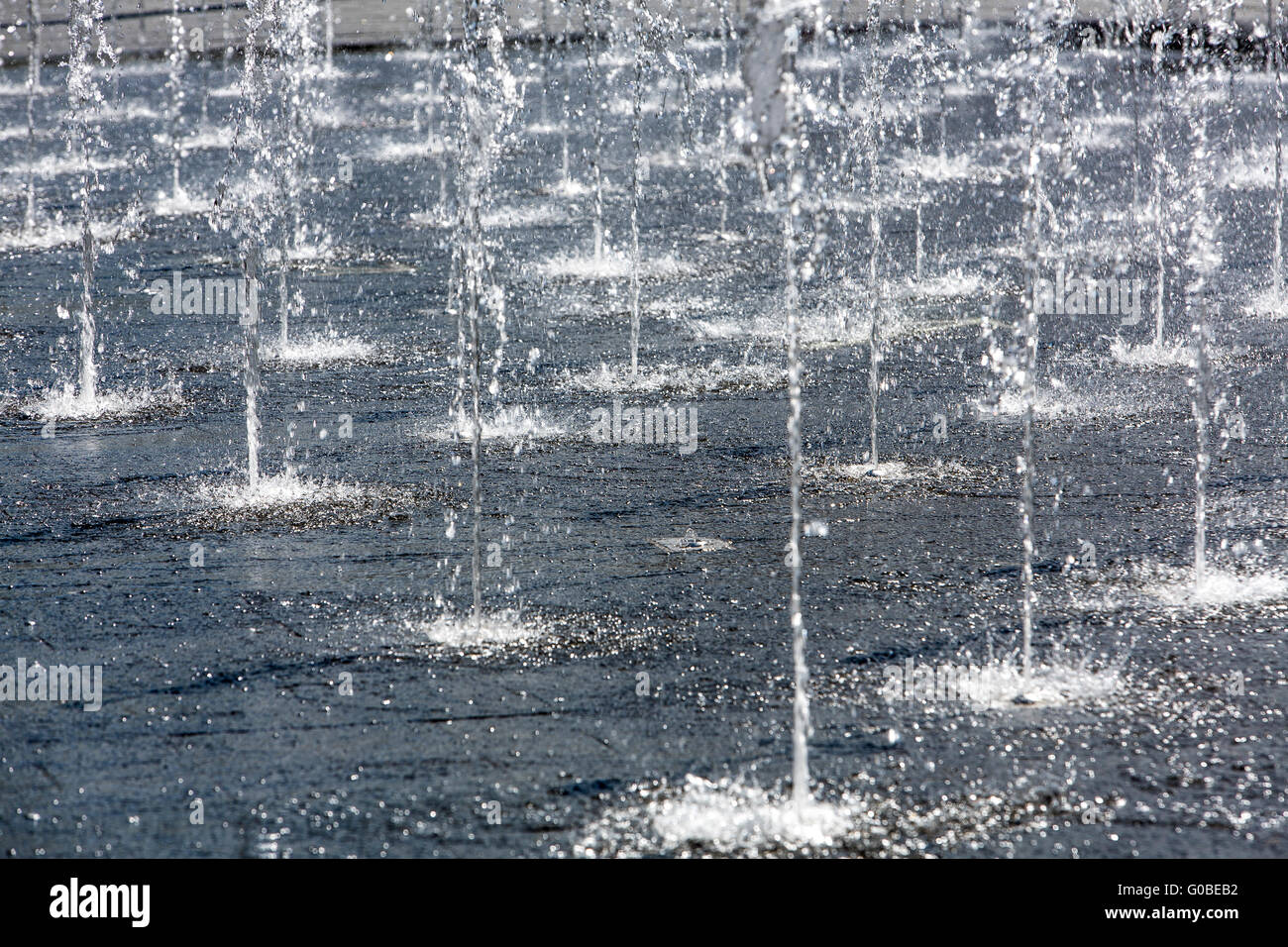 Fountain, embedded in the ground, water fountains Stock Photo - Alamy