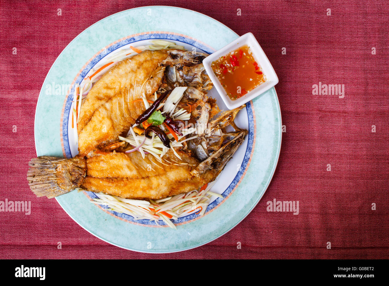 Deep-fried snapper with spicy sauce, style thai food Stock Photo - Alamy