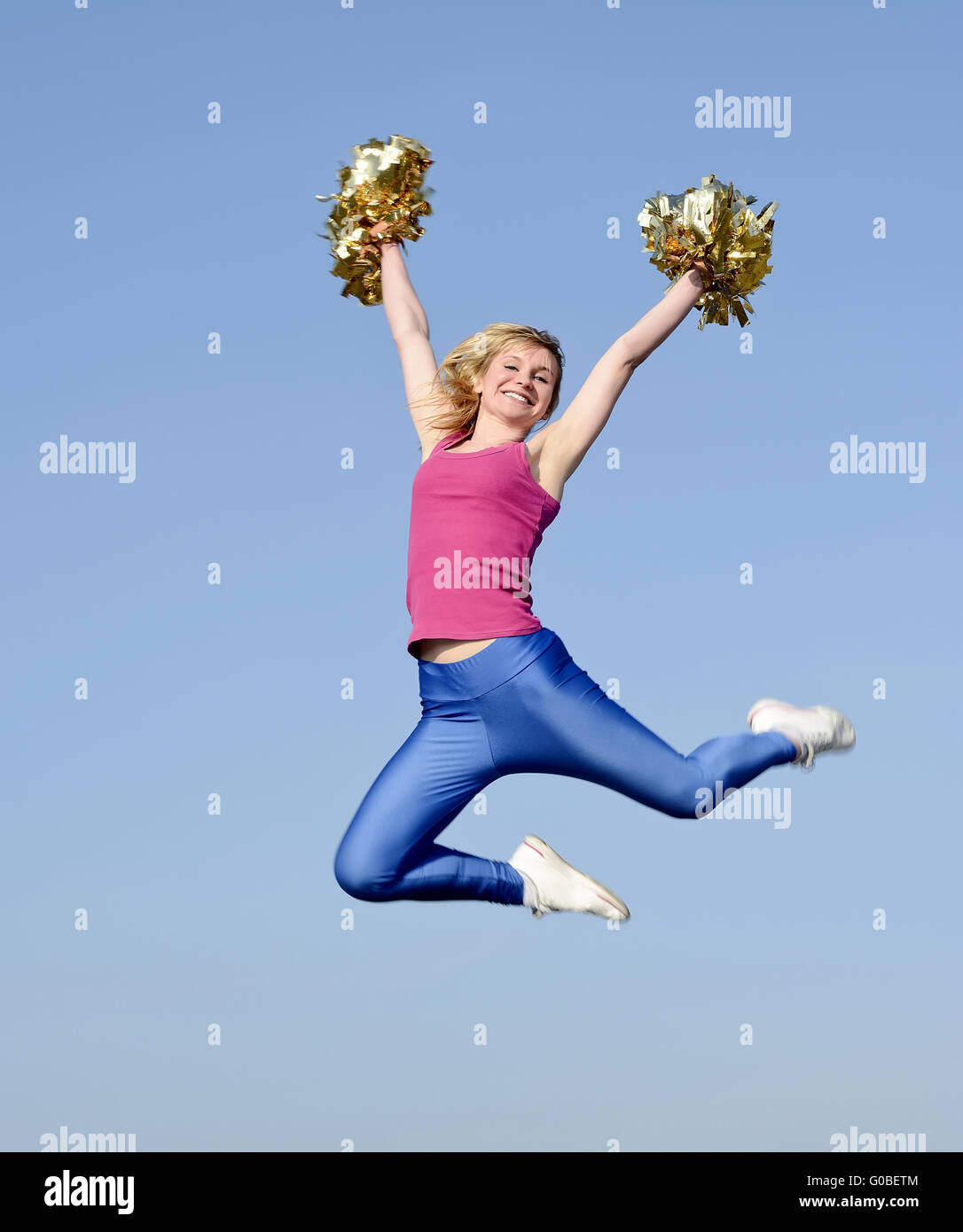 Cheerleader jumping hi-res stock photography and images - Alamy