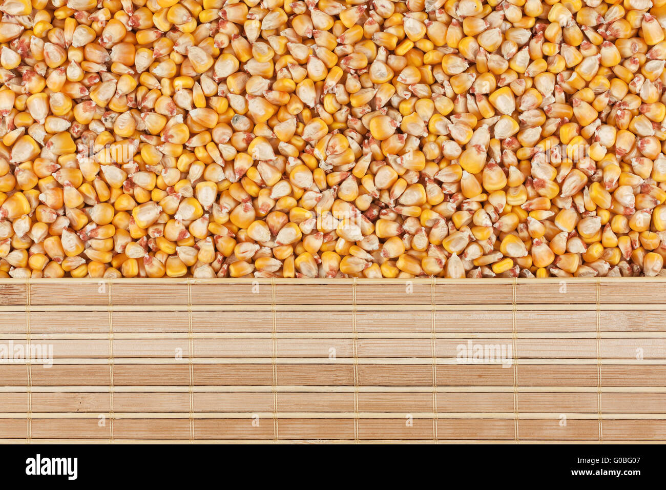 Corn grain and bamboo mat, with place for your text Stock Photo - Alamy