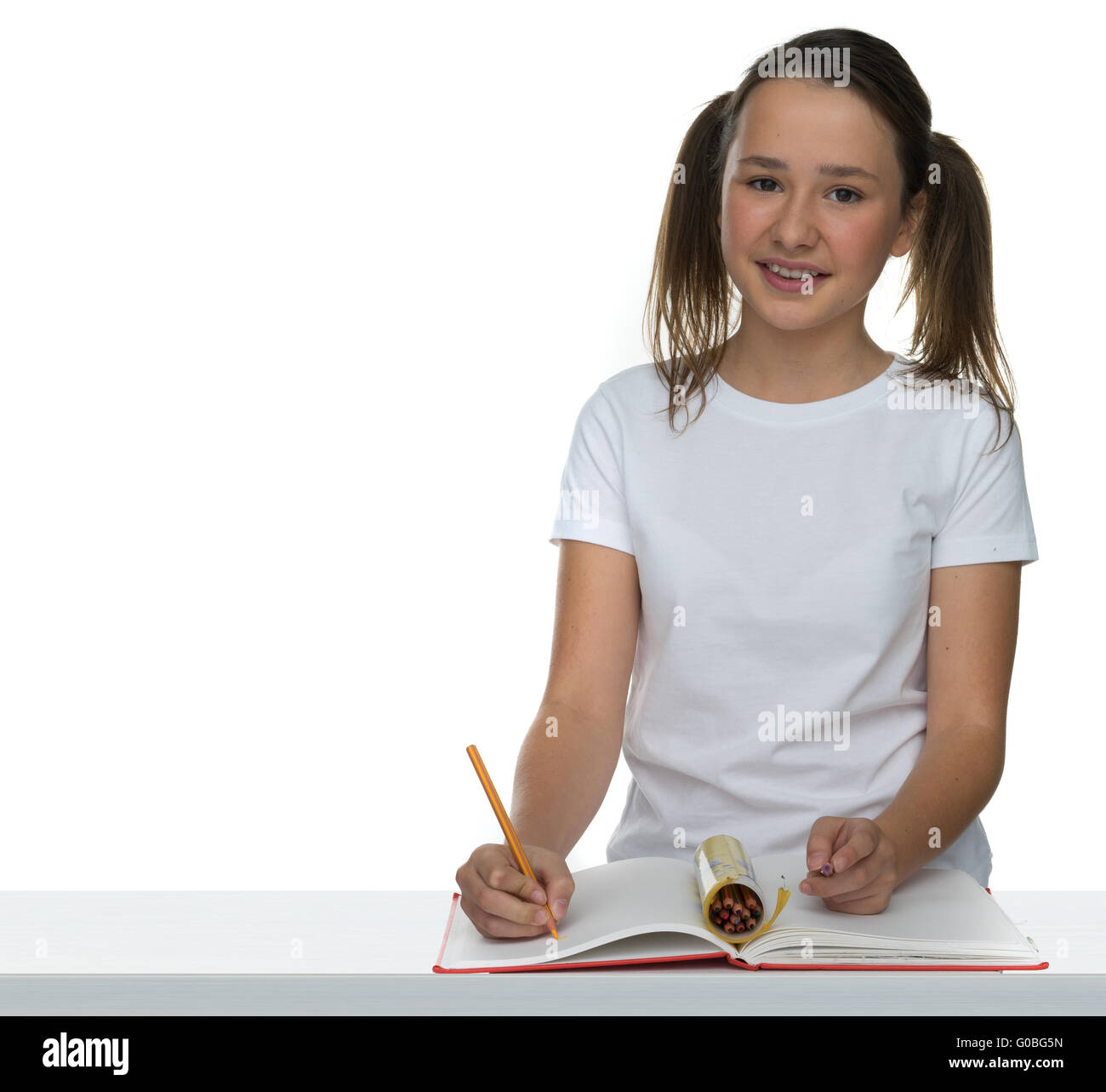 Cute young schoolgirl in class Stock Photo - Alamy