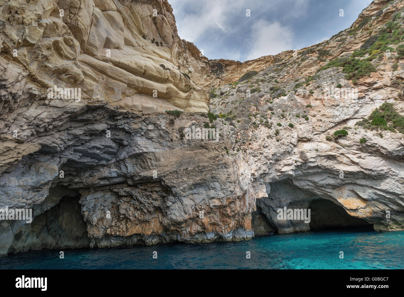 Caves and cliffs at the coast of Gozo Island Stock Photo - Alamy