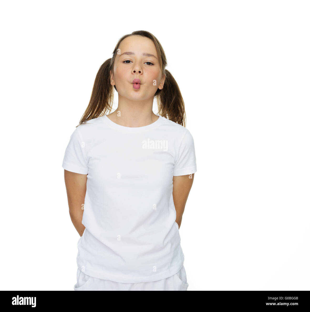 Cute young girl puckering up for a kiss Stock Photo - Alamy