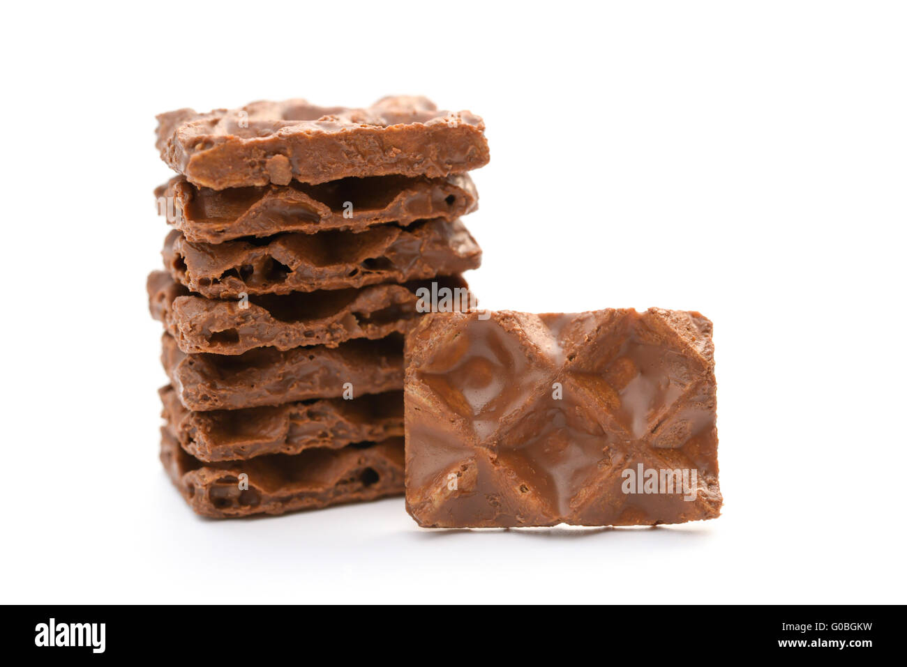 chocolate blocks stack up on a white background Stock Photo - Alamy